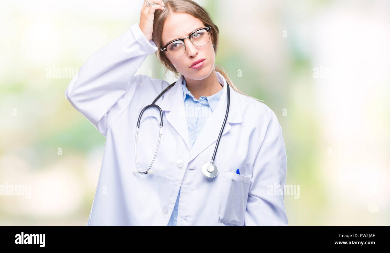 Beautiful young blonde doctor woman wearing medical uniform over ...