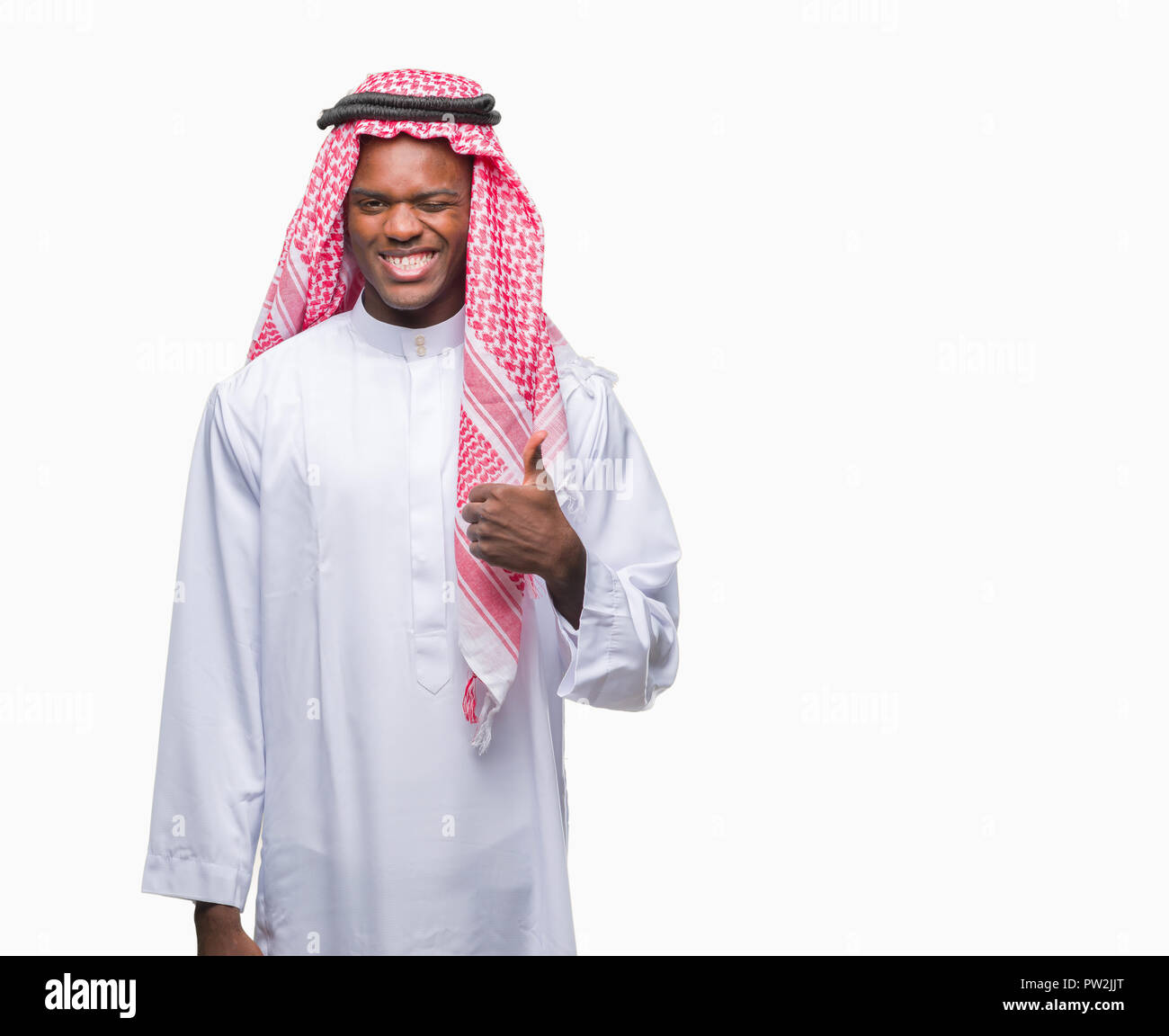 Young arabic african man wearing traditional keffiyeh over isolated ...