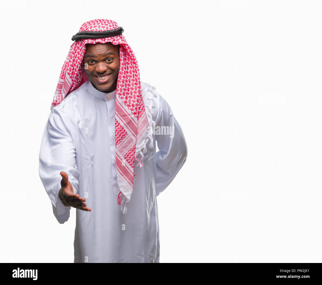 Young arabic african man wearing traditional keffiyeh over isolated ...