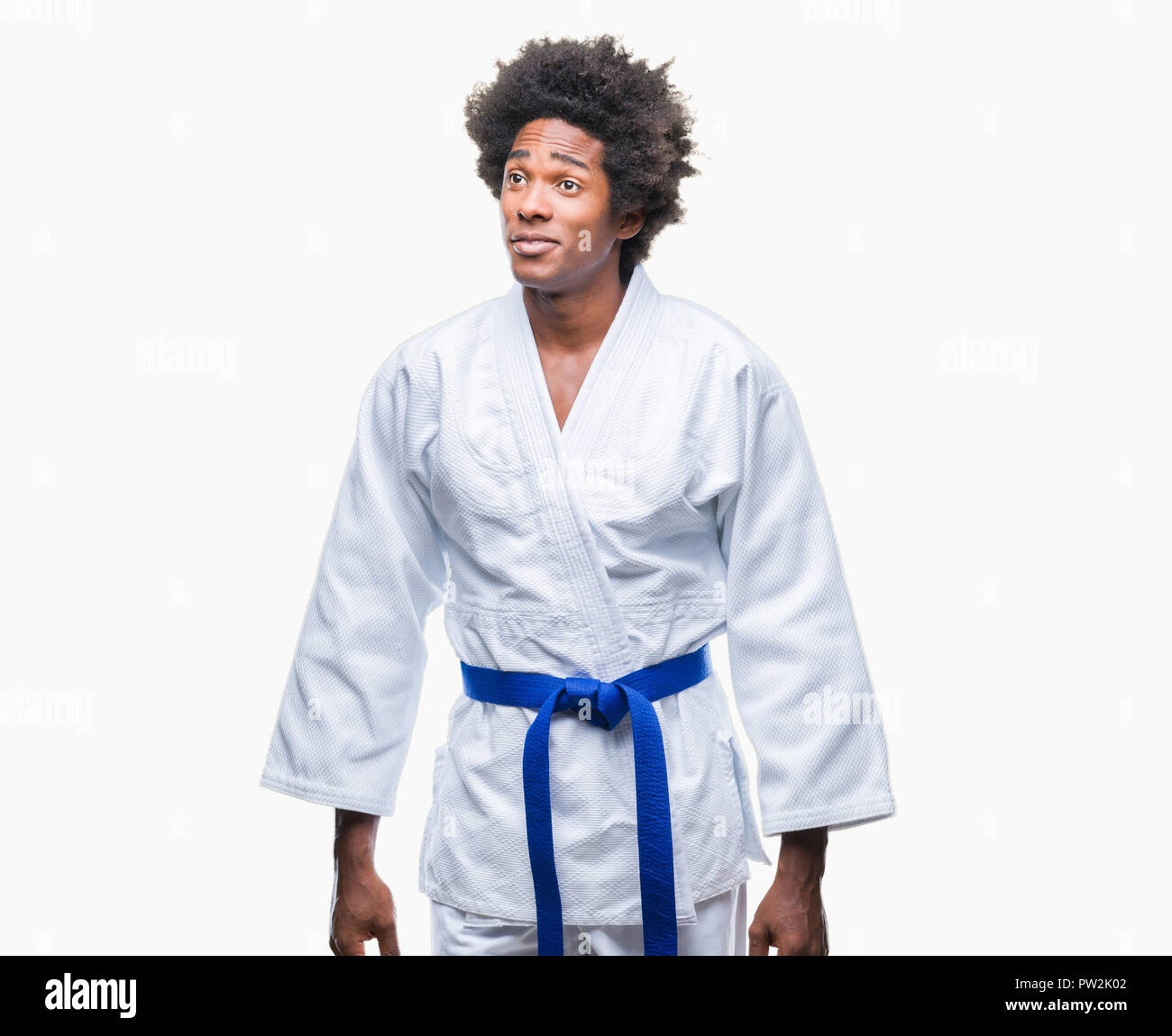 Afro american man wearing karate kimono over isolated background ...