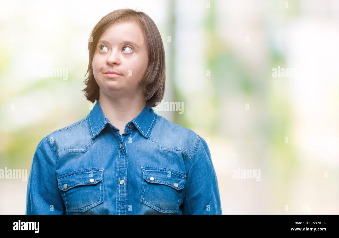 Young adult woman with down syndrome over isolated background smiling ...