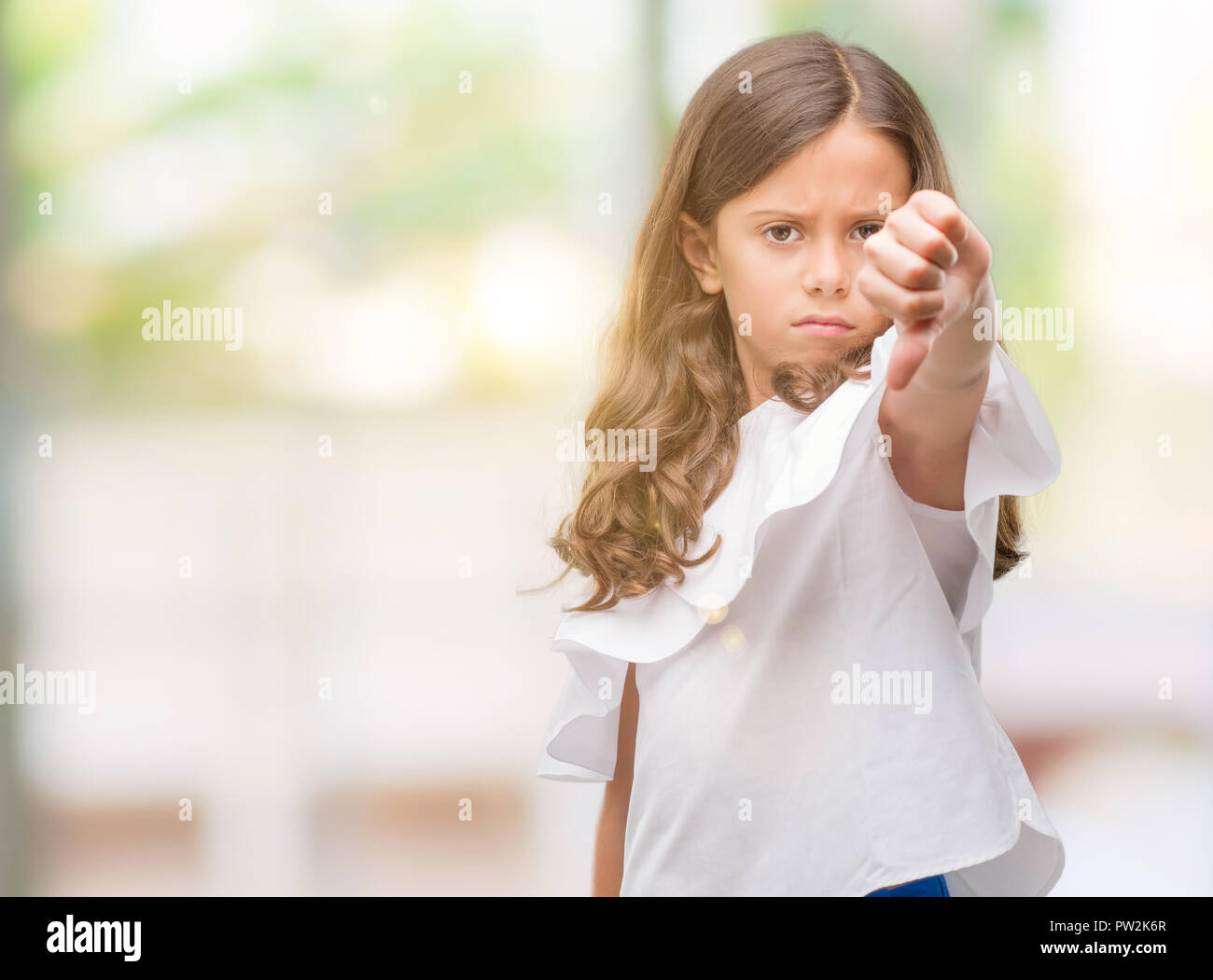 Brunette hispanic girl looking unhappy and angry showing rejection and ...