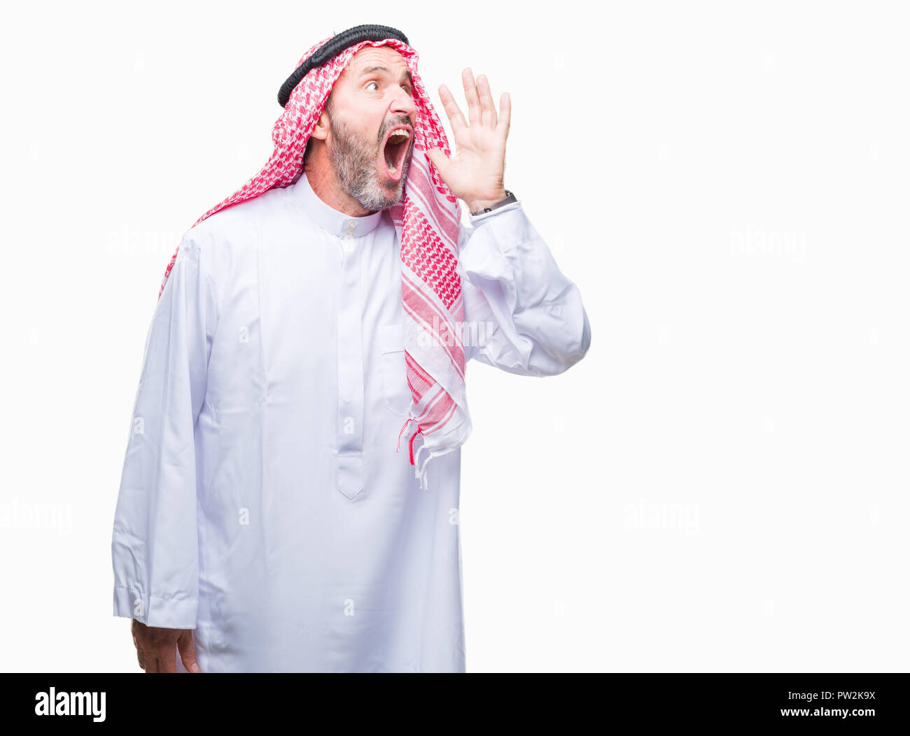 Senior arab man wearing keffiyeh over isolated background shouting and ...