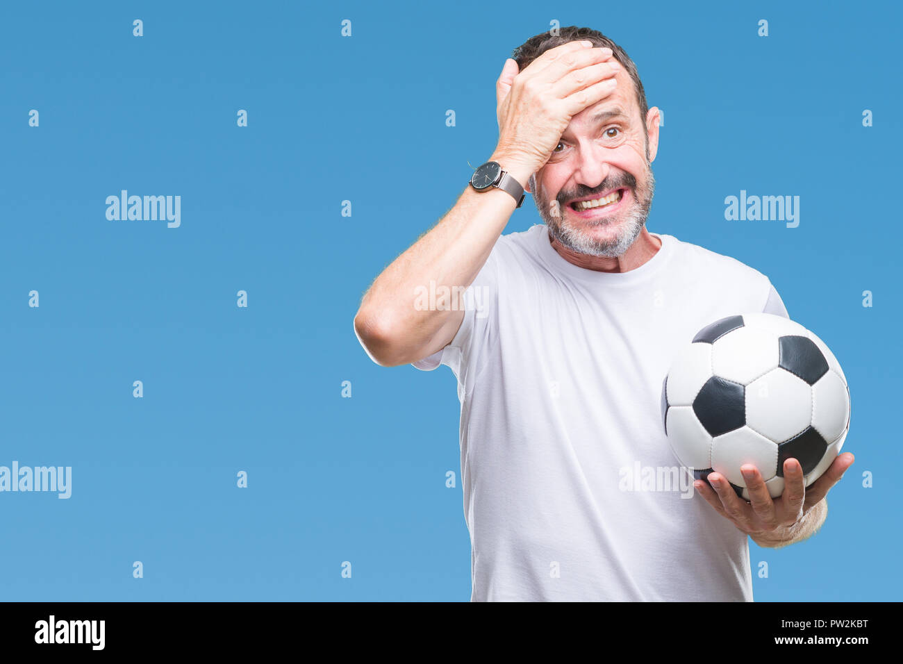 Middle age hoary senior man holding soccer football ball over isolated ...