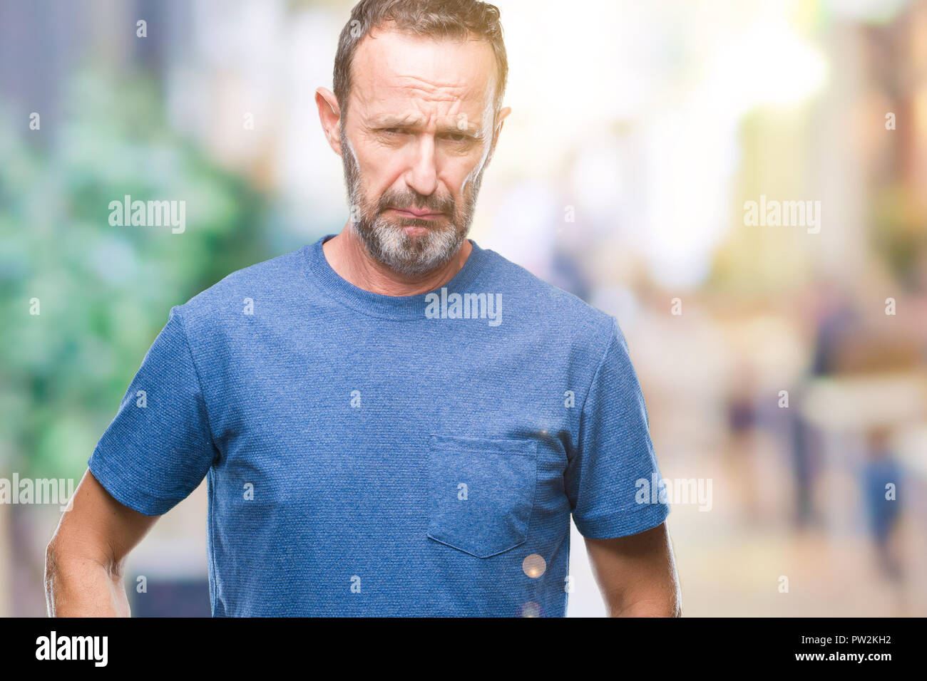 Middle age hoary senior man over isolated background depressed and ...