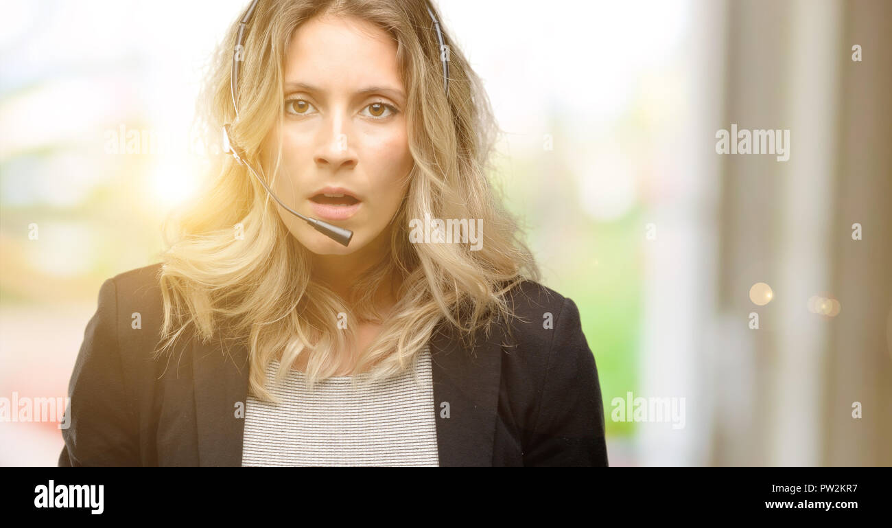 Young woman operator from call center scared in shock, expressing panic ...