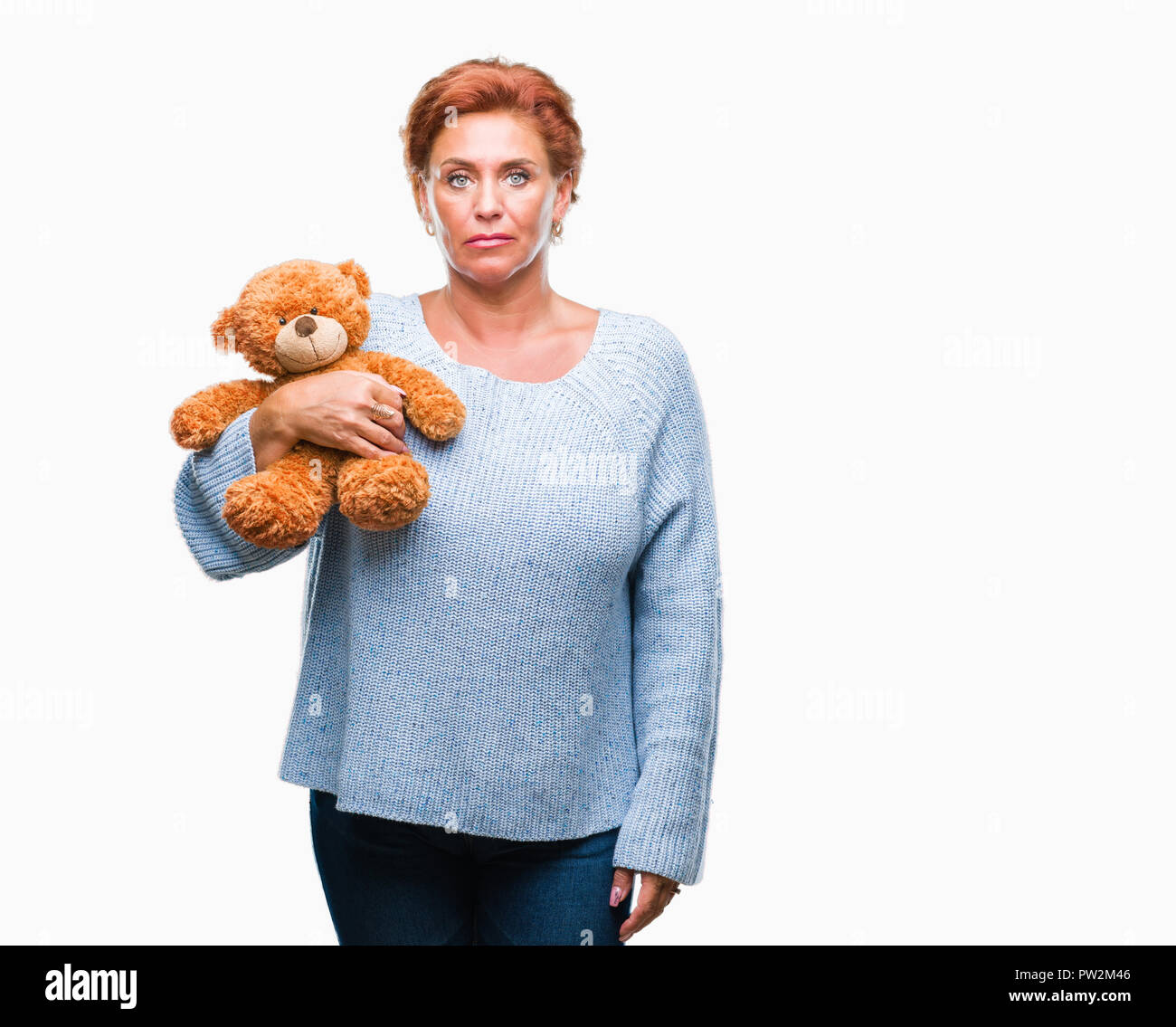 Senior caucasian woman holding teddy bear over isolated background with ...