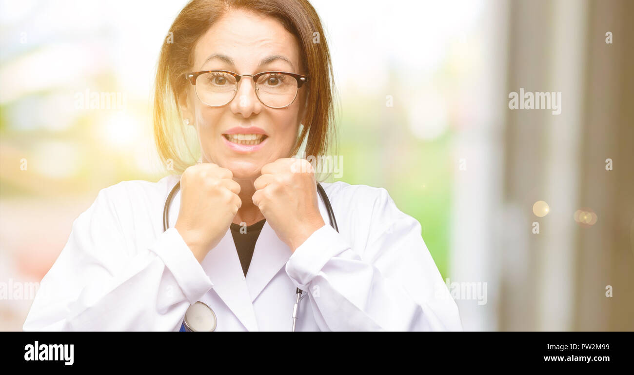 Doctor woman, medical professional terrified and nervous expressing ...