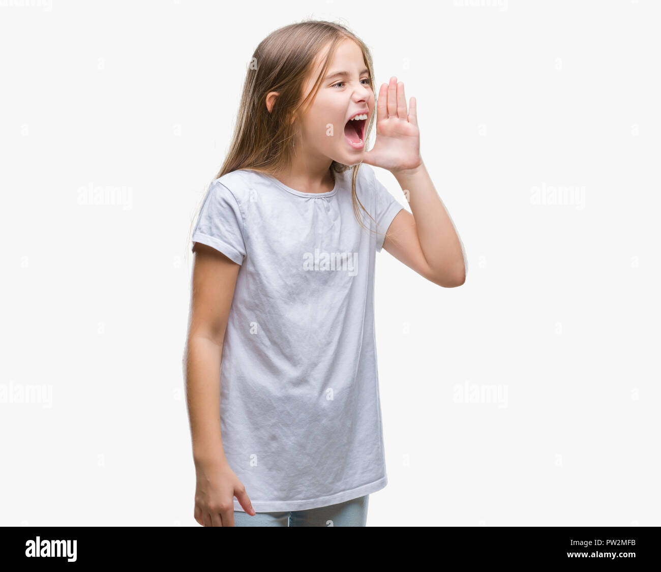 Young beautiful girl over isolated background shouting and screaming ...