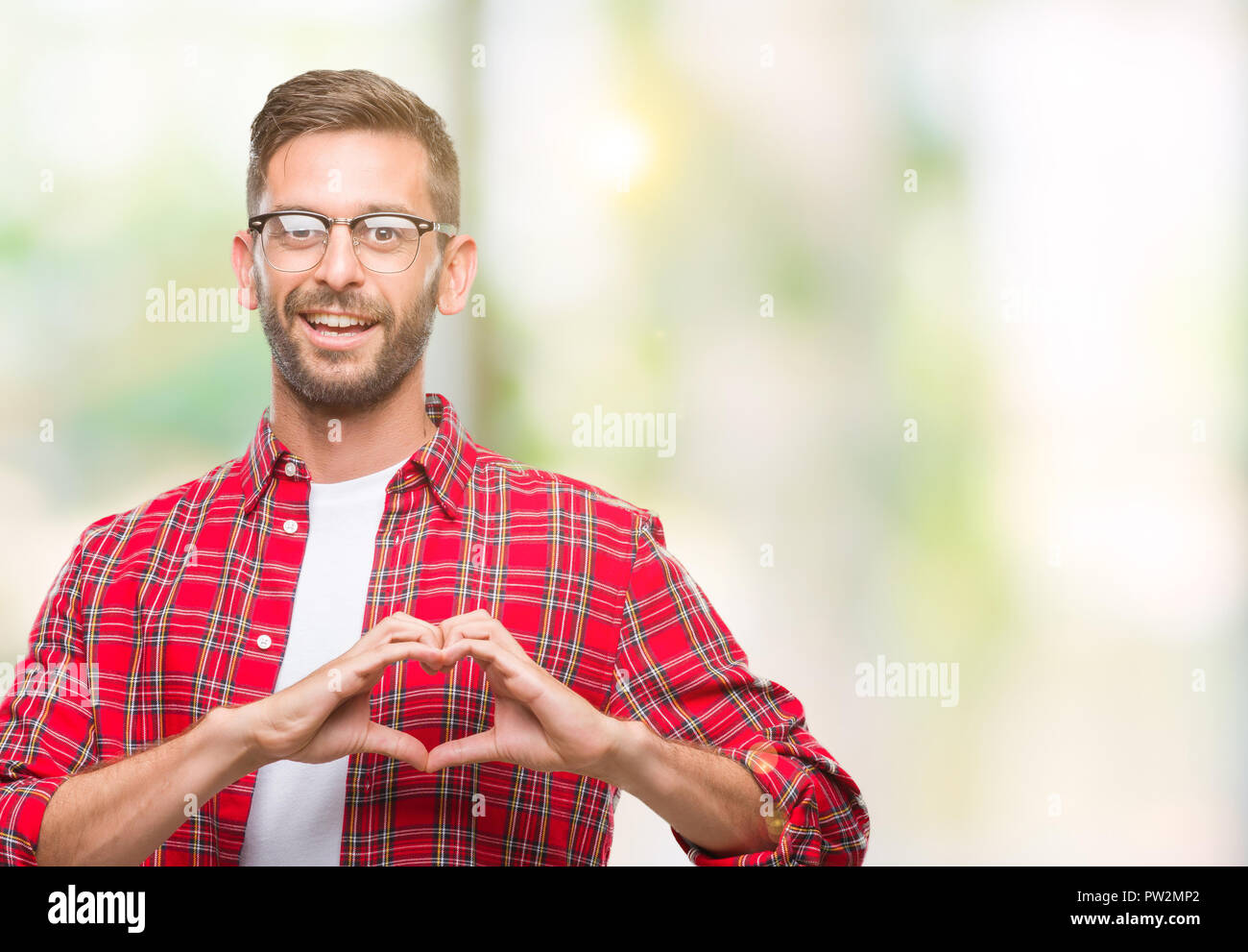 Young handsome man over isolated background smiling in love showing ...