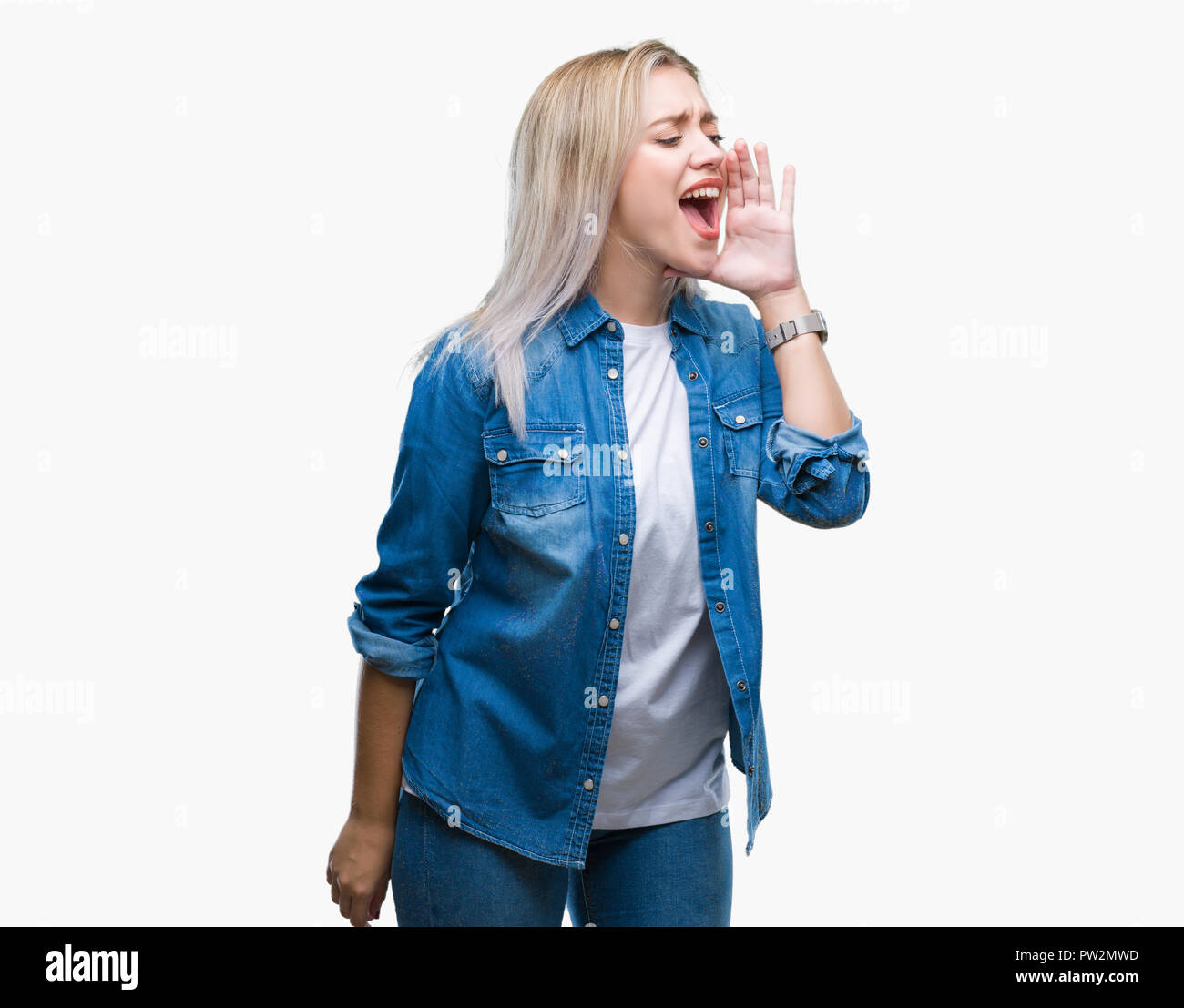 Young blonde woman over isolated background shouting and screaming loud ...