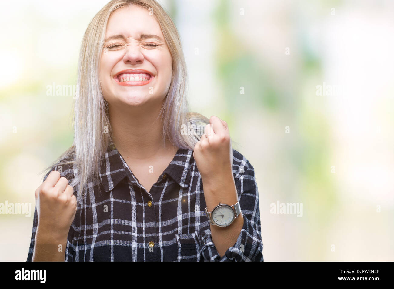 Young blonde woman over isolated background very happy and excited ...