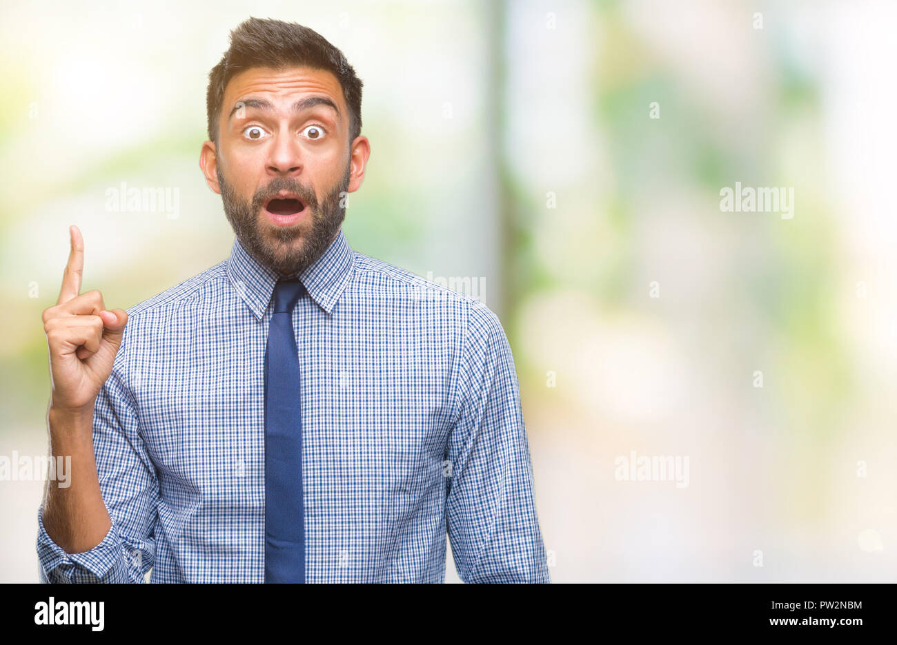 Adult hispanic business man over isolated background pointing finger up ...