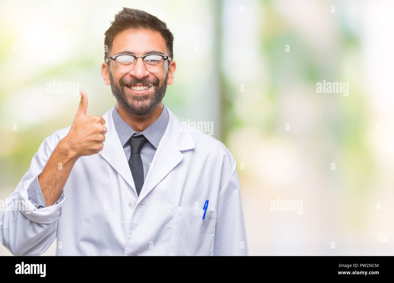 Adult hispanic scientist or doctor man wearing white coat over isolated ...