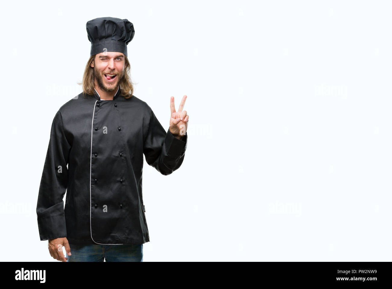 Young handsome cook man with long hair over isolated background smiling ...
