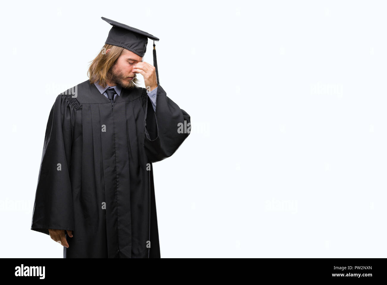 Young handsome graduated man with long hair over isolated background ...