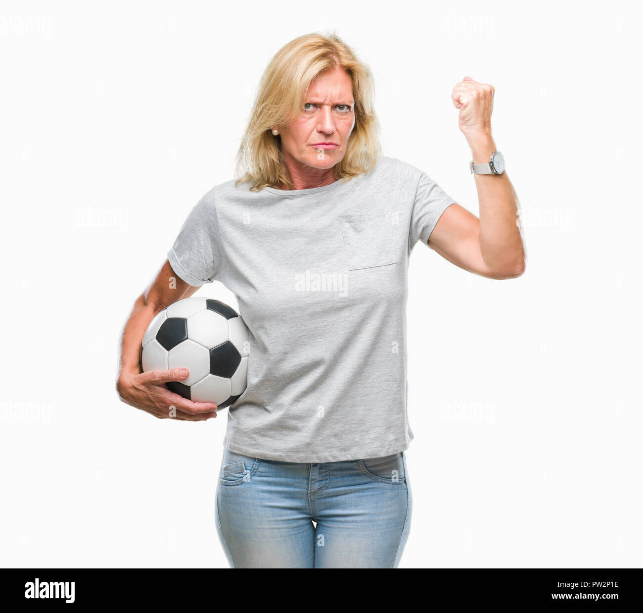 Middle age blonde woman holding soccer football ball over isolated ...