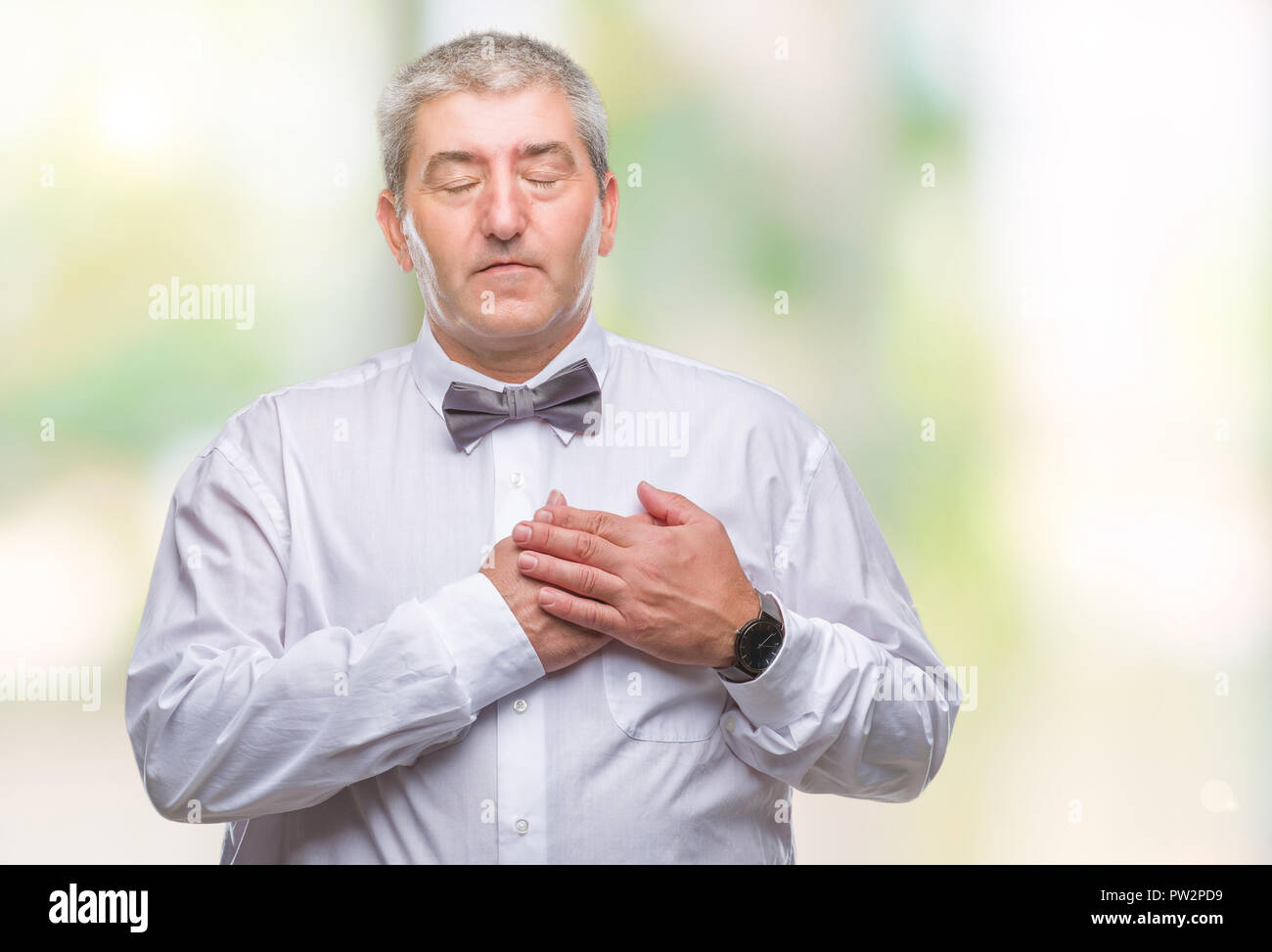 Handsome senior man wearing bow tie over isolated background smiling ...