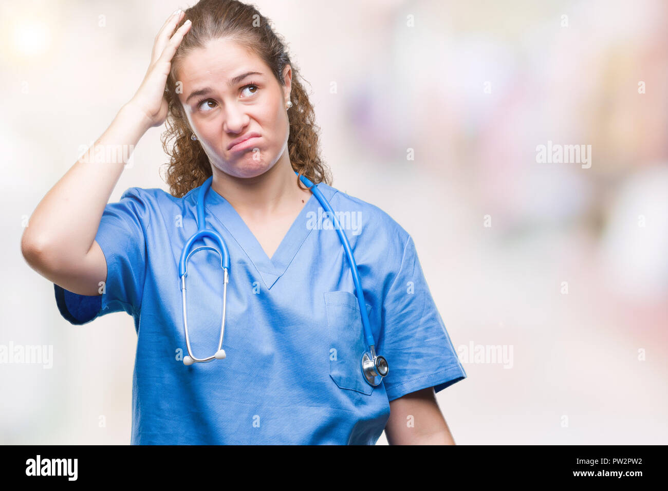 Young brunette doctor girl wearing nurse or surgeon uniform over ...