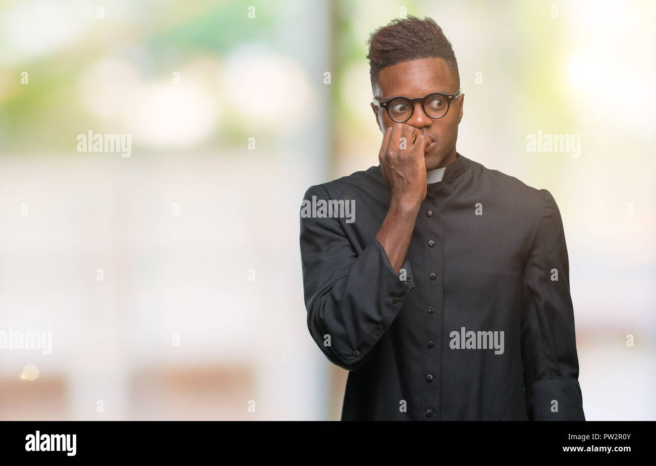 Young african american priest man over isolated background looking ...
