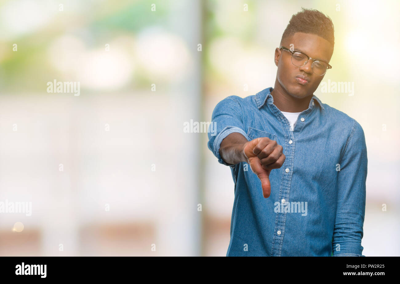 Young african american man over isolated background looking unhappy and ...
