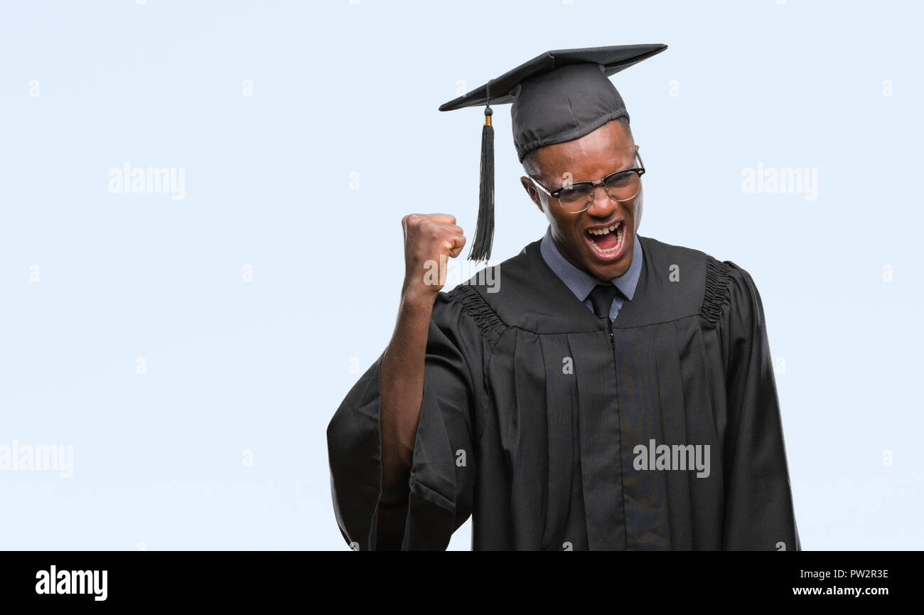 Young graduated african american man over isolated background angry and ...