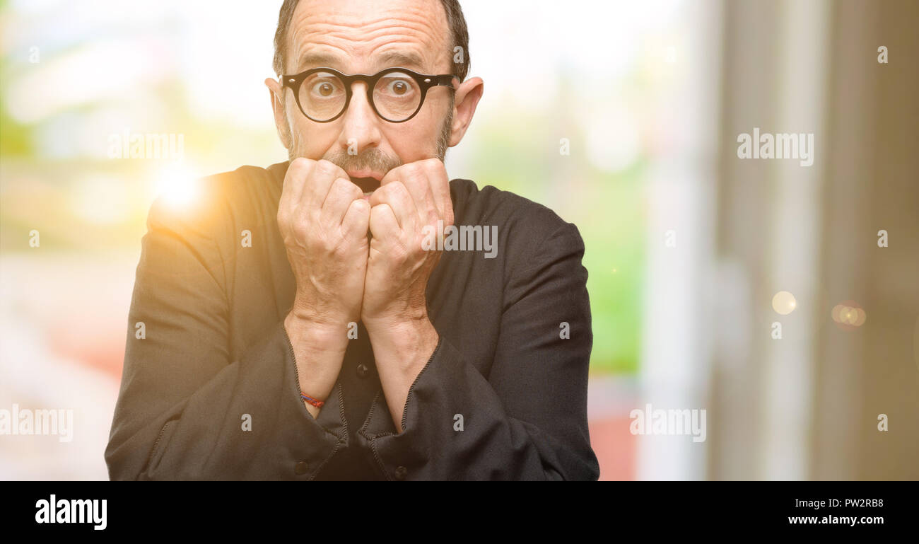 Priest religion man terrified and nervous expressing anxiety and panic ...