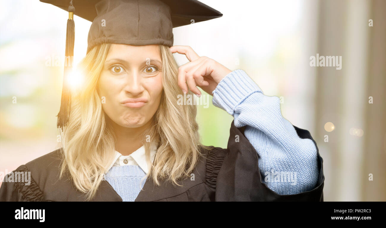 Young graduate woman doubt expression, confuse and wonder concept ...