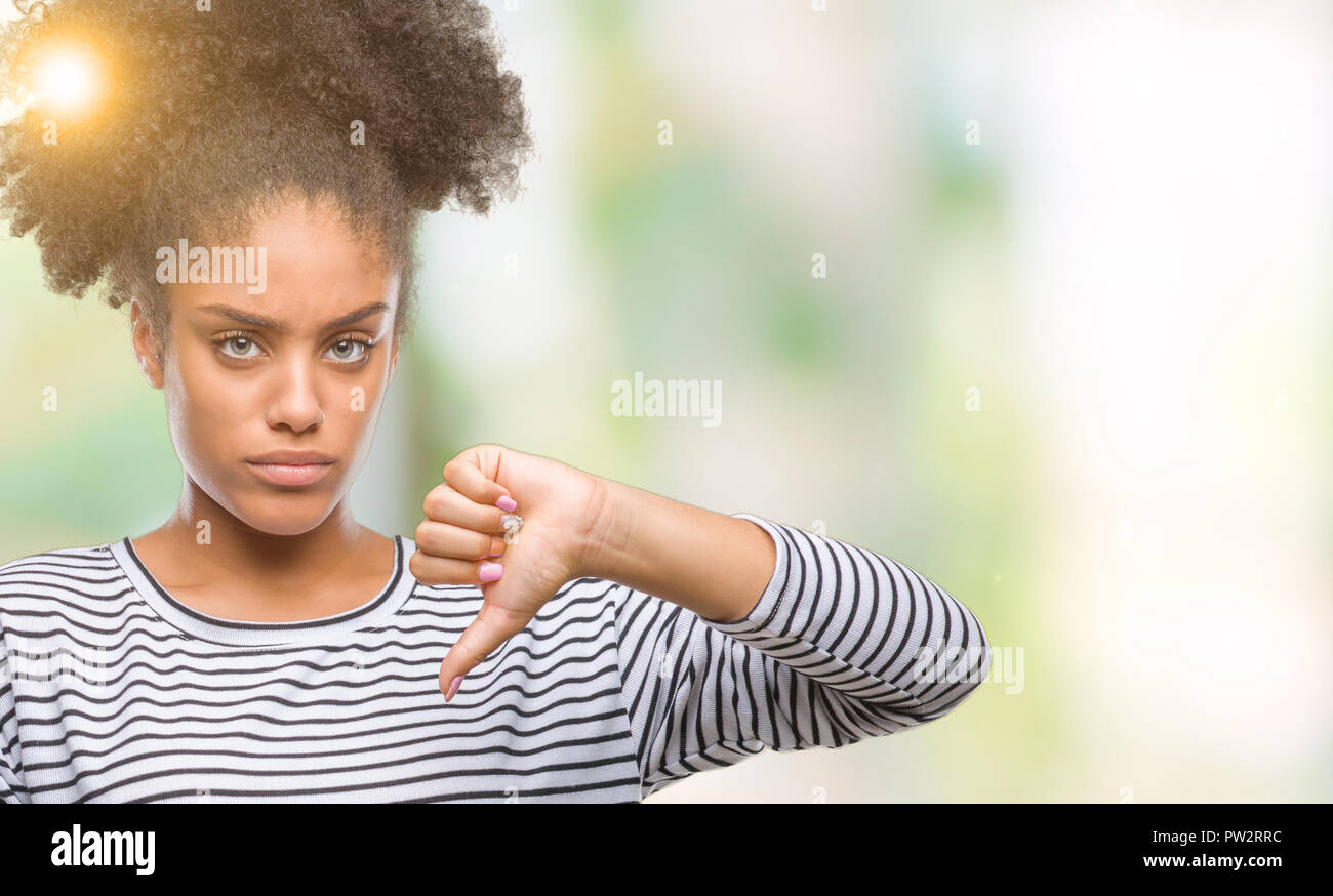 Young afro american woman texting using smartphone over isolated ...