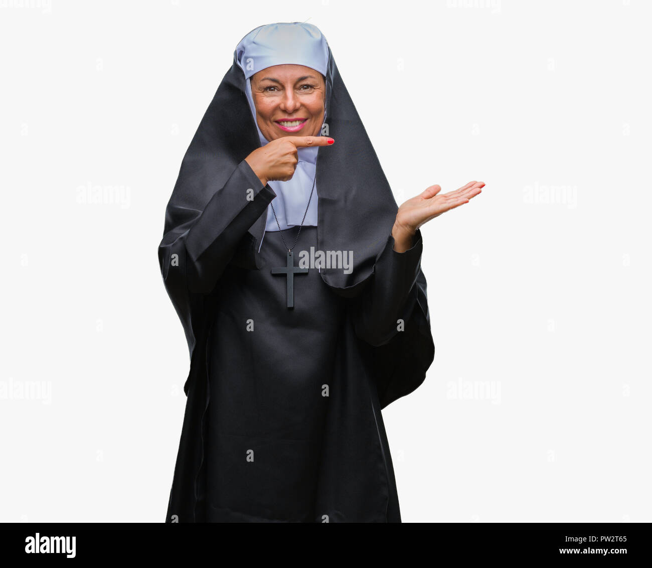 Middle age senior christian catholic nun woman over isolated background ...