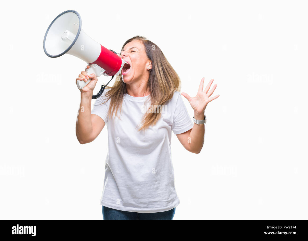 Middle age hispanic woman yelling through megaphone over isolated ...