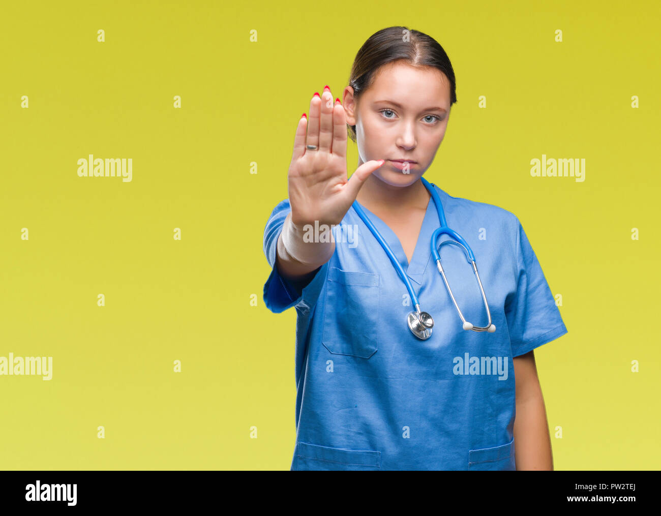 Young caucasian doctor woman wearing medical uniform over isolated ...