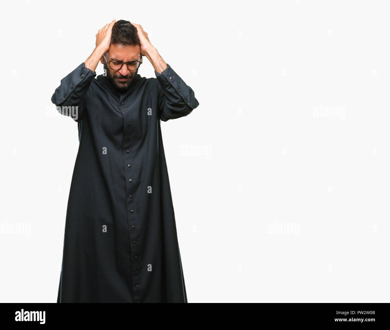 Adult hispanic catholic priest man over isolated background suffering ...