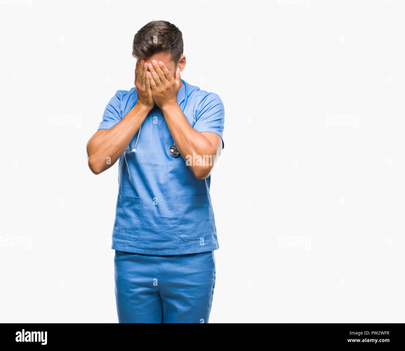 Young handsome doctor surgeon man over isolated background with sad ...