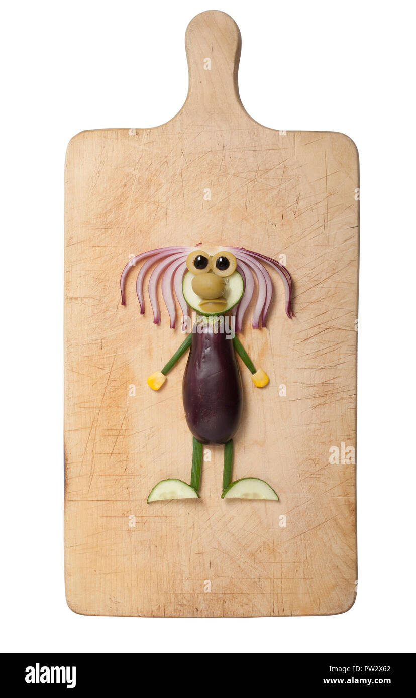 Human figure made from vegetables on cutting board Stock Photo - Alamy