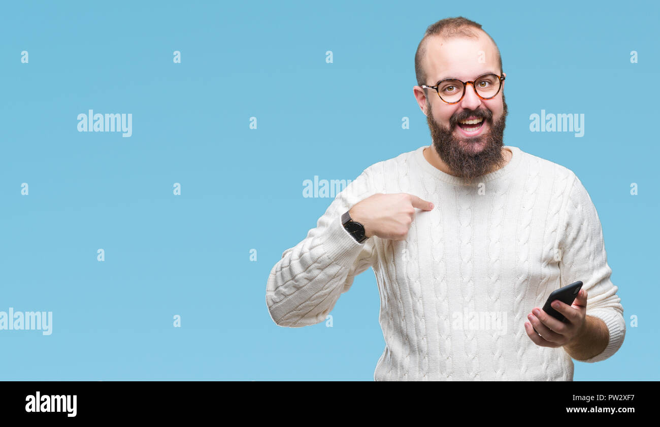 Young caucasian hipster man texting sending message using smartphone ...
