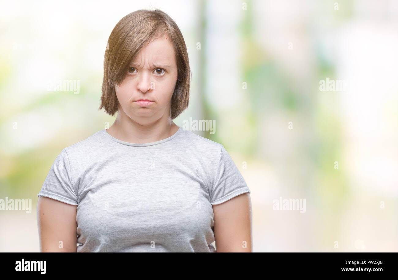 Young adult woman with down syndrome over isolated background with ...