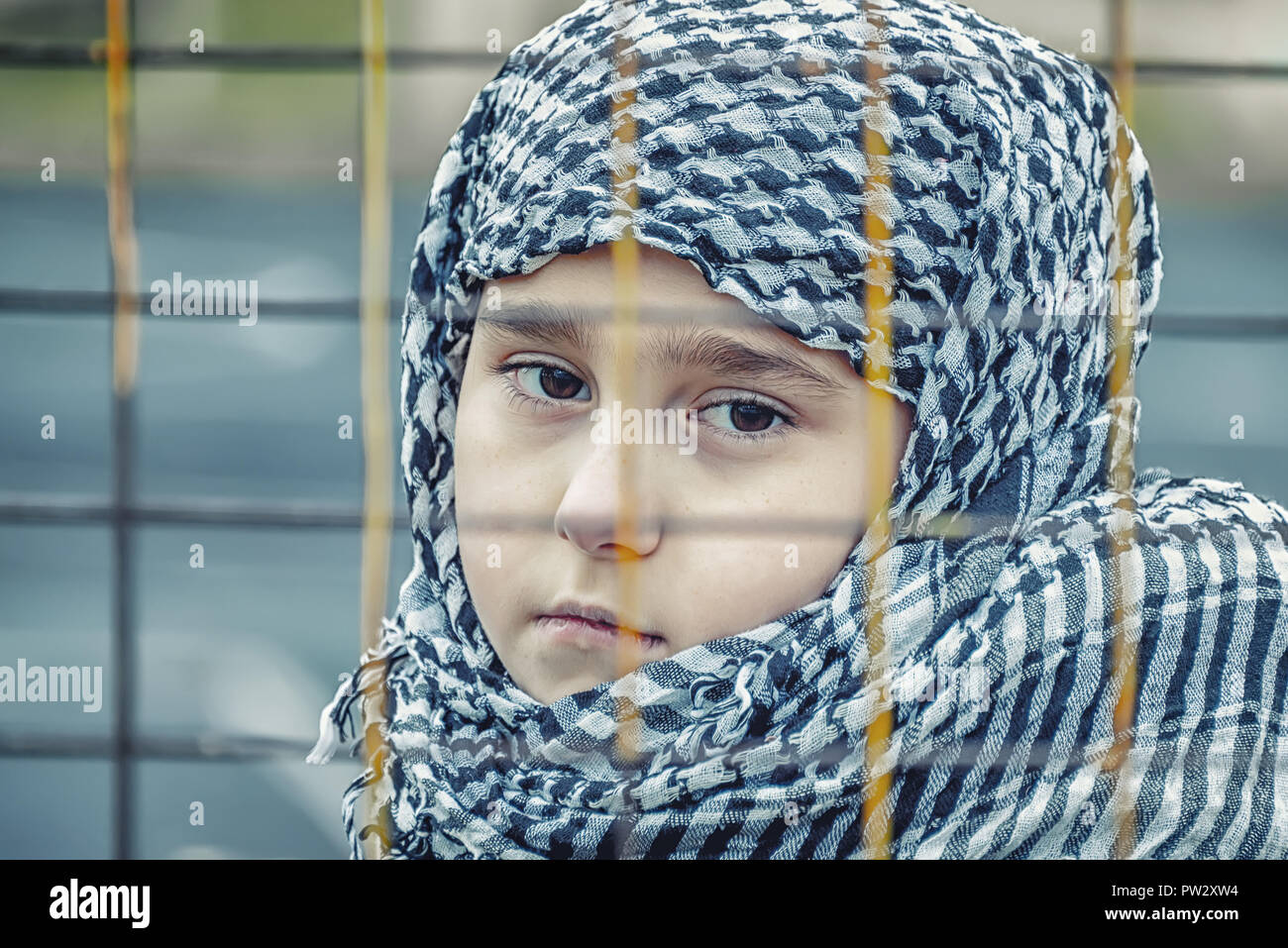 crying refugee girl from the east in a headscarf Stock Photo - Alamy