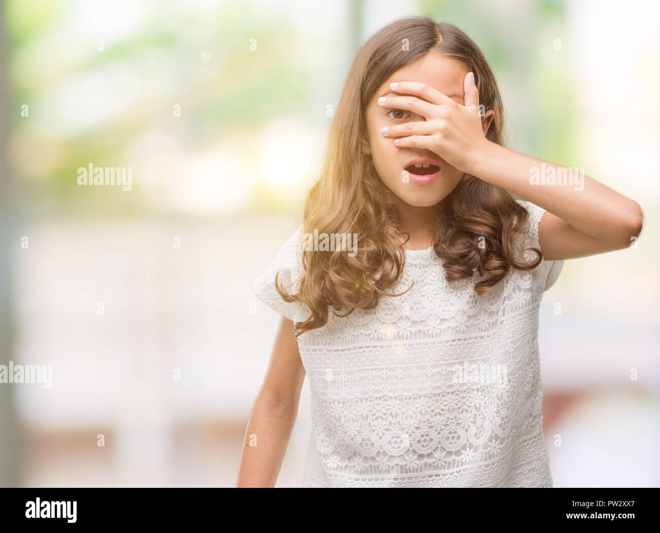 Timid girl hiding hi-res stock photography and images - Alamy