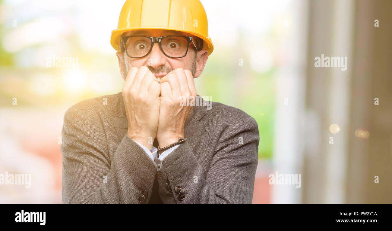 Senior architect or engineer terrified and nervous expressing anxiety ...