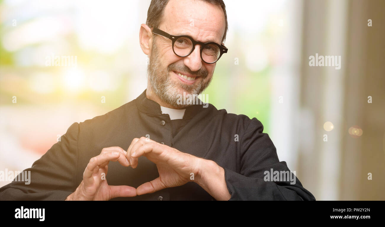 Priest religion man happy showing love with hands in heart shape ...