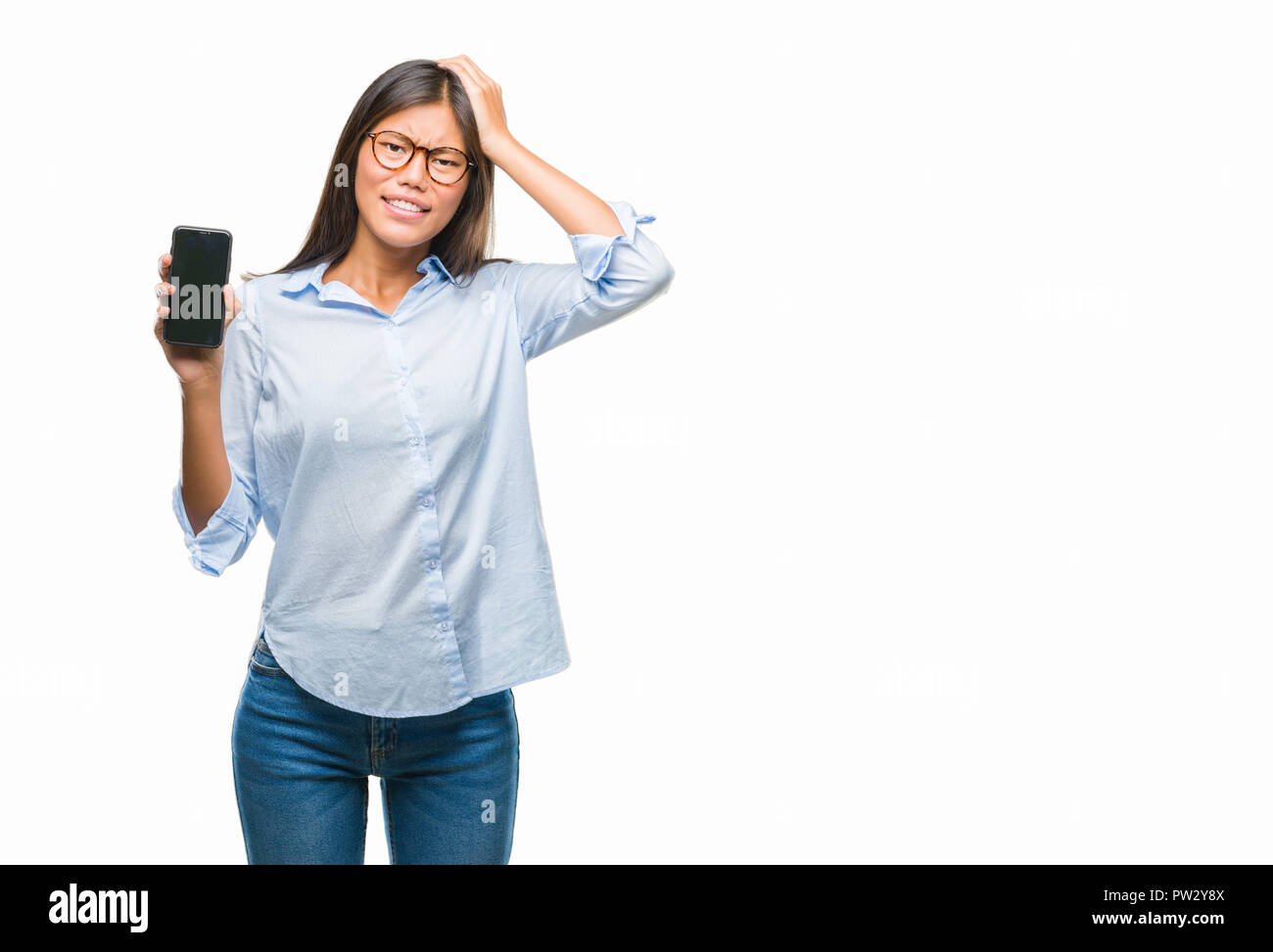 Young asian woman showing smartphone blank screen over isolated ...