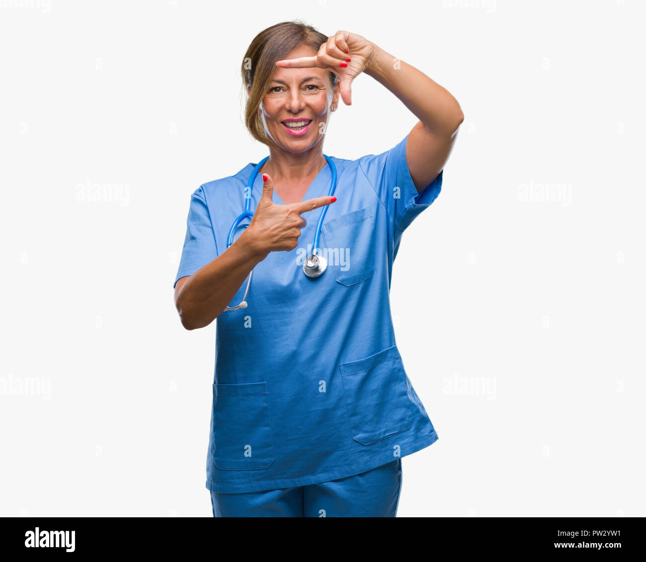 Middle age senior nurse doctor woman over isolated background smiling ...