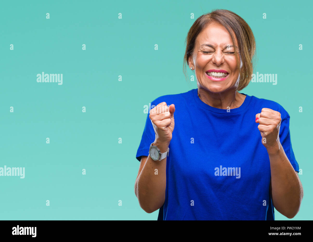 Middle age senior hispanic woman over isolated background excited for ...