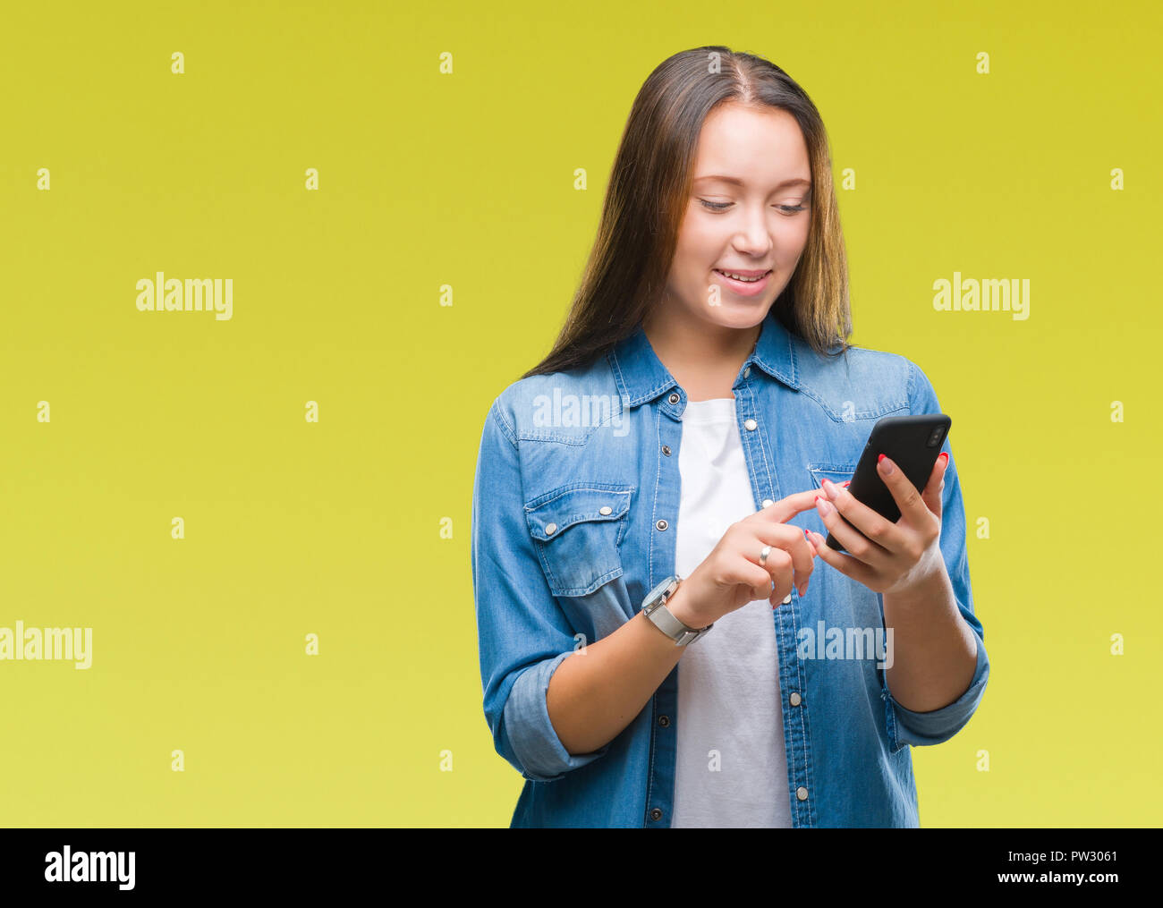 Young beautiful caucasian woman texting sending message using ...