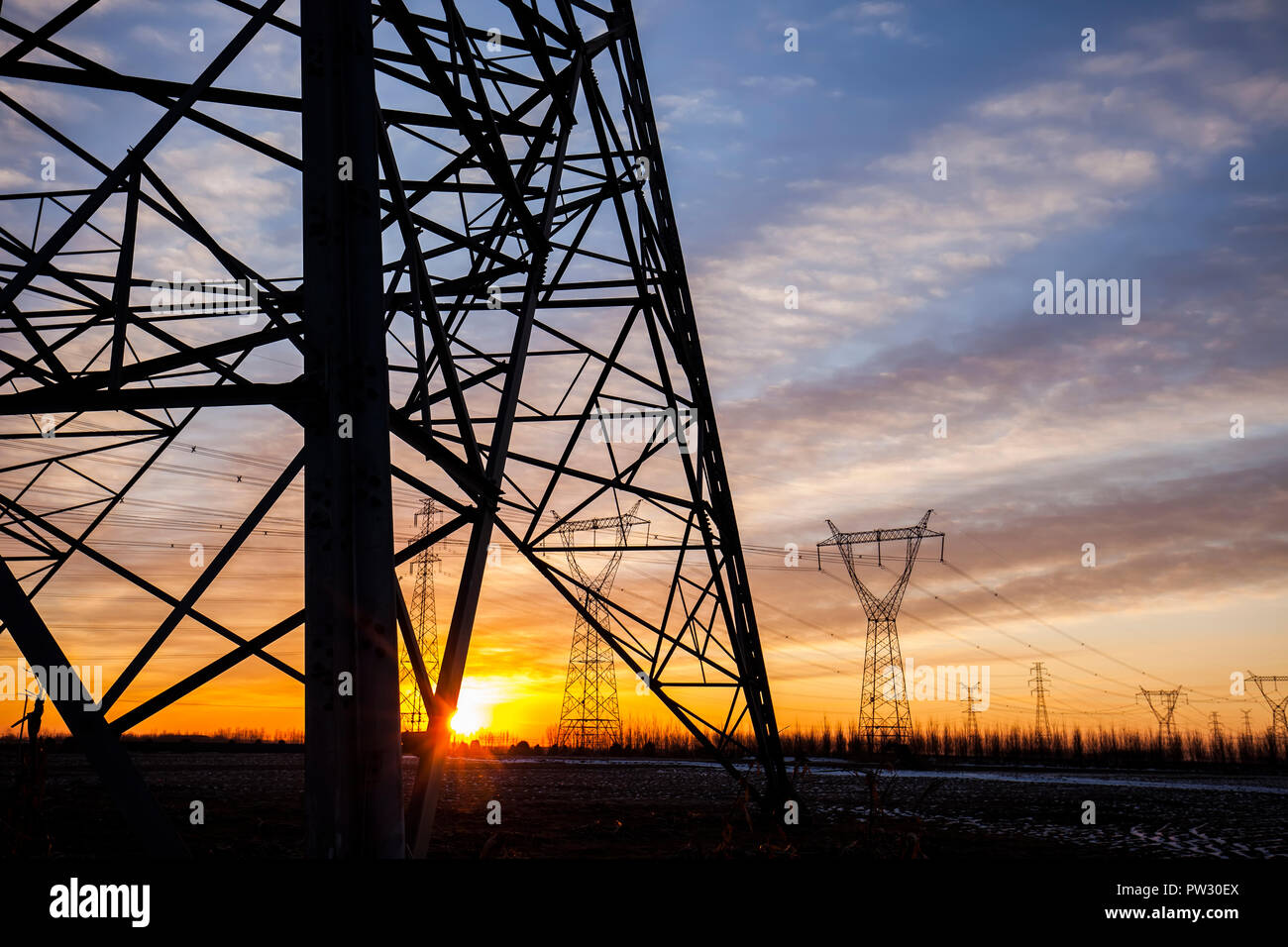 The silhouette of the evening electricity transmission pylon Stock ...