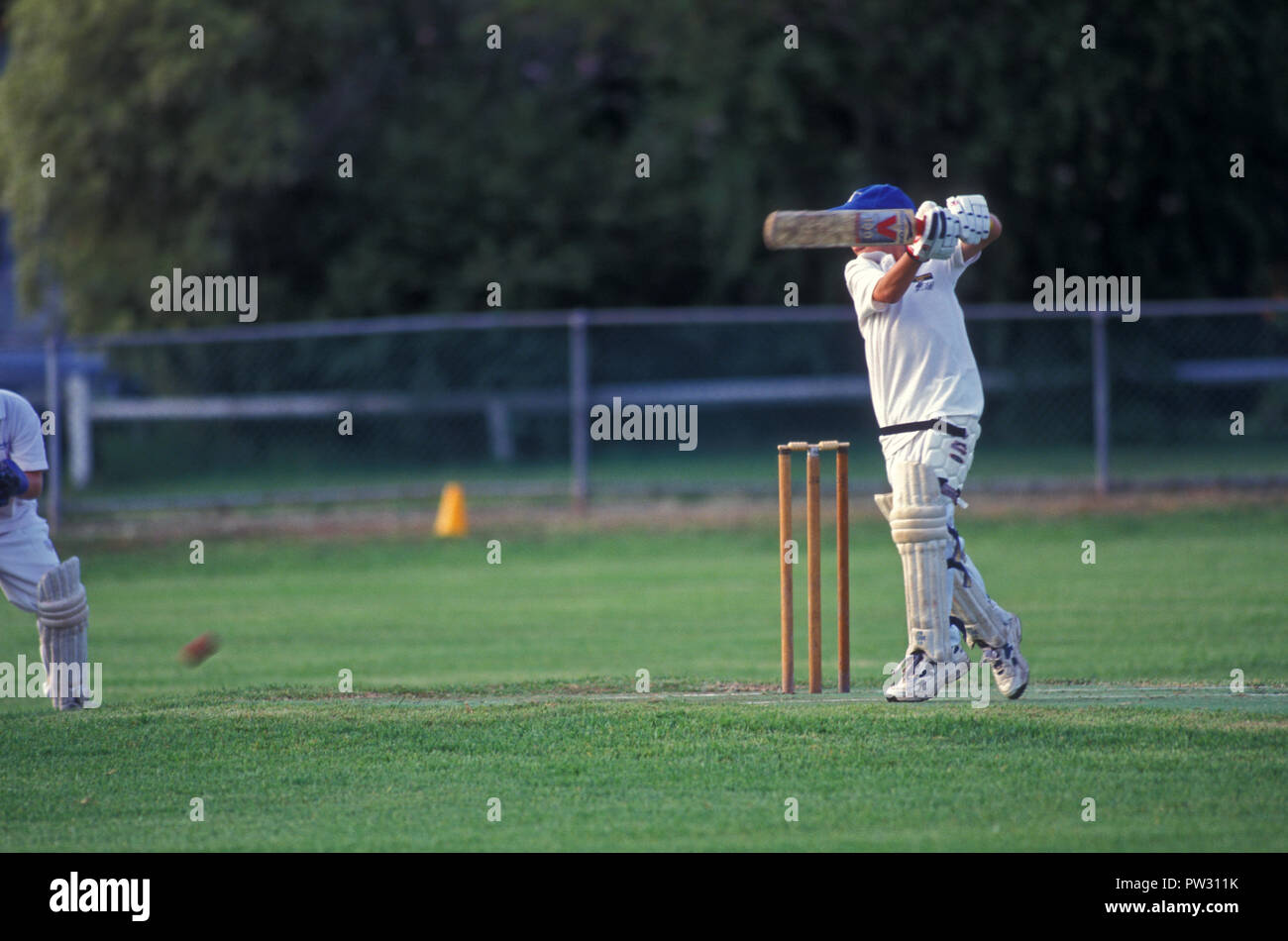 Children with cricket bat and ball hi-res stock photography and images ...