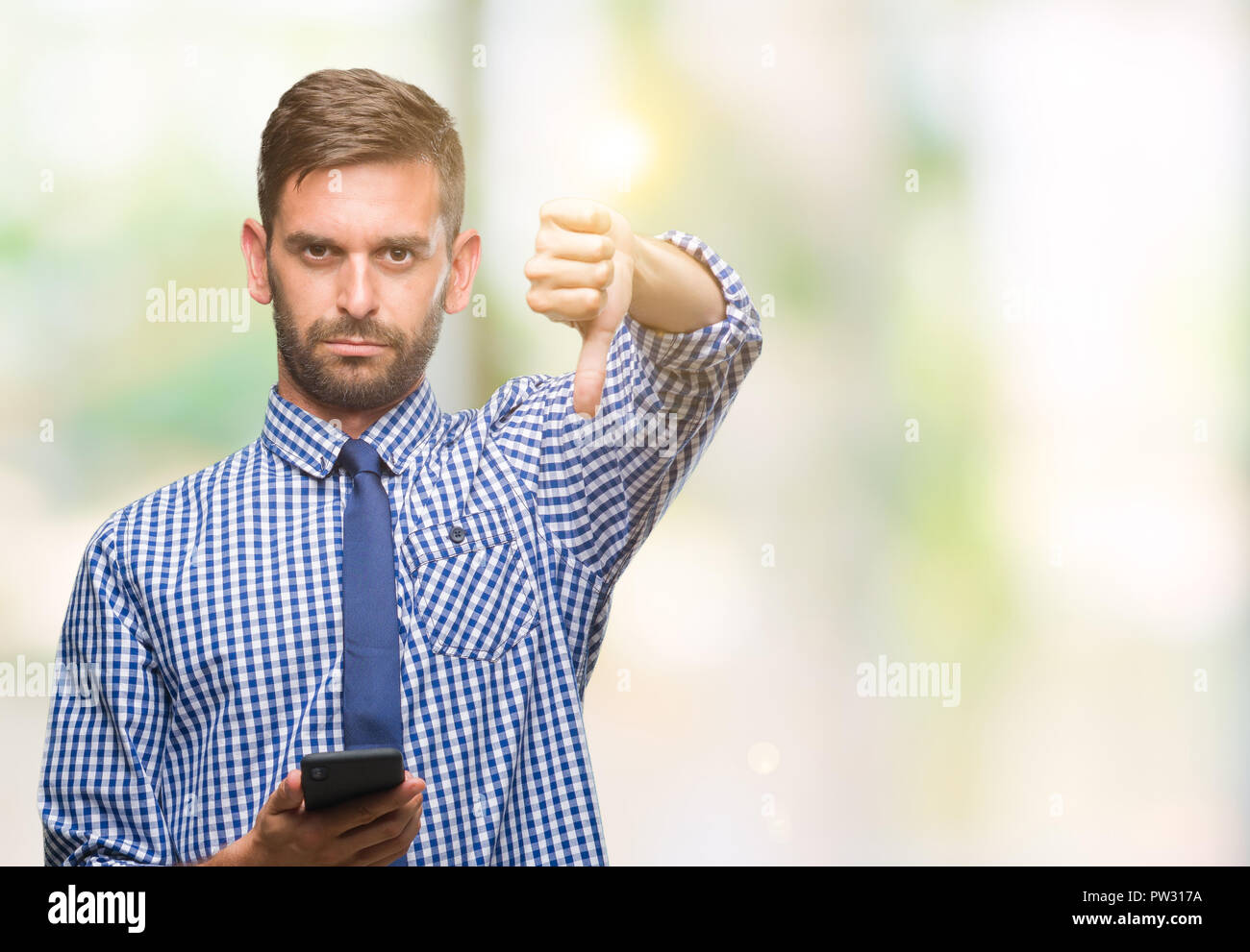Young hadsome man texting sending message using smartphone over ...