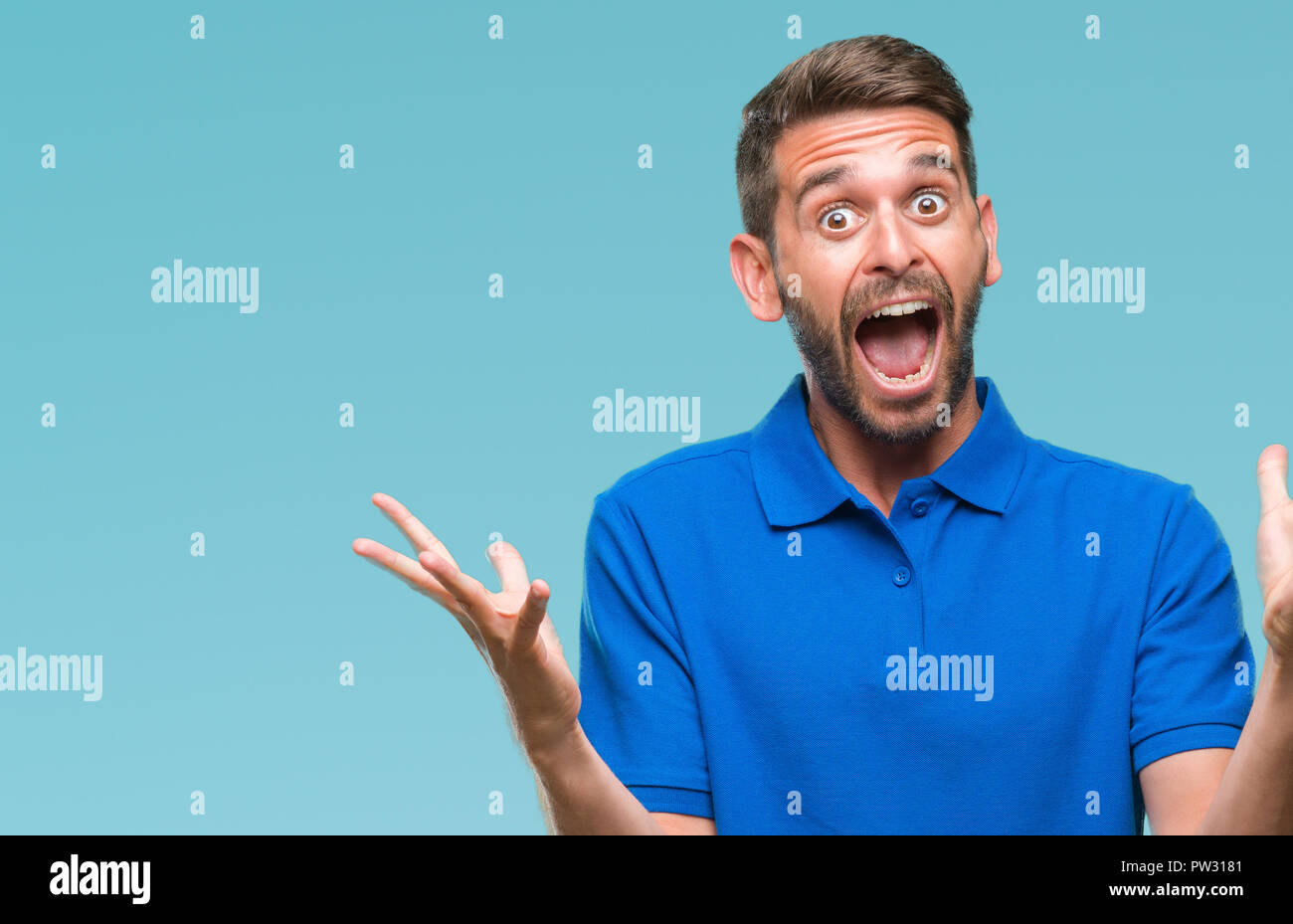 Young handsome man over isolated background celebrating crazy and ...