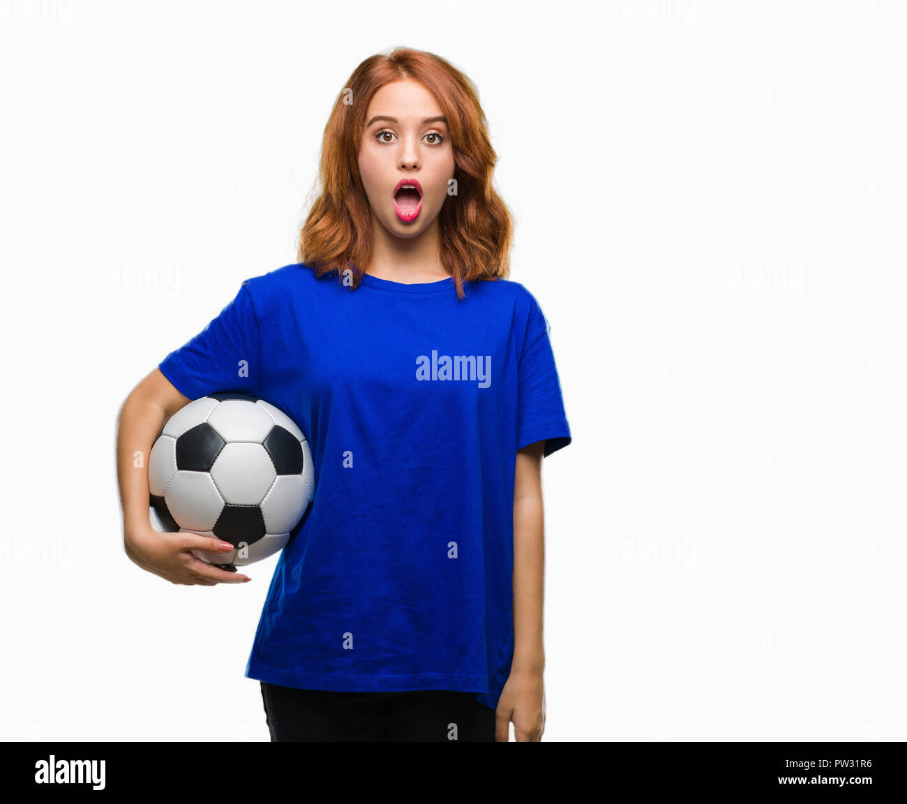 Young beautiful woman over isolated background holding soccer football ...